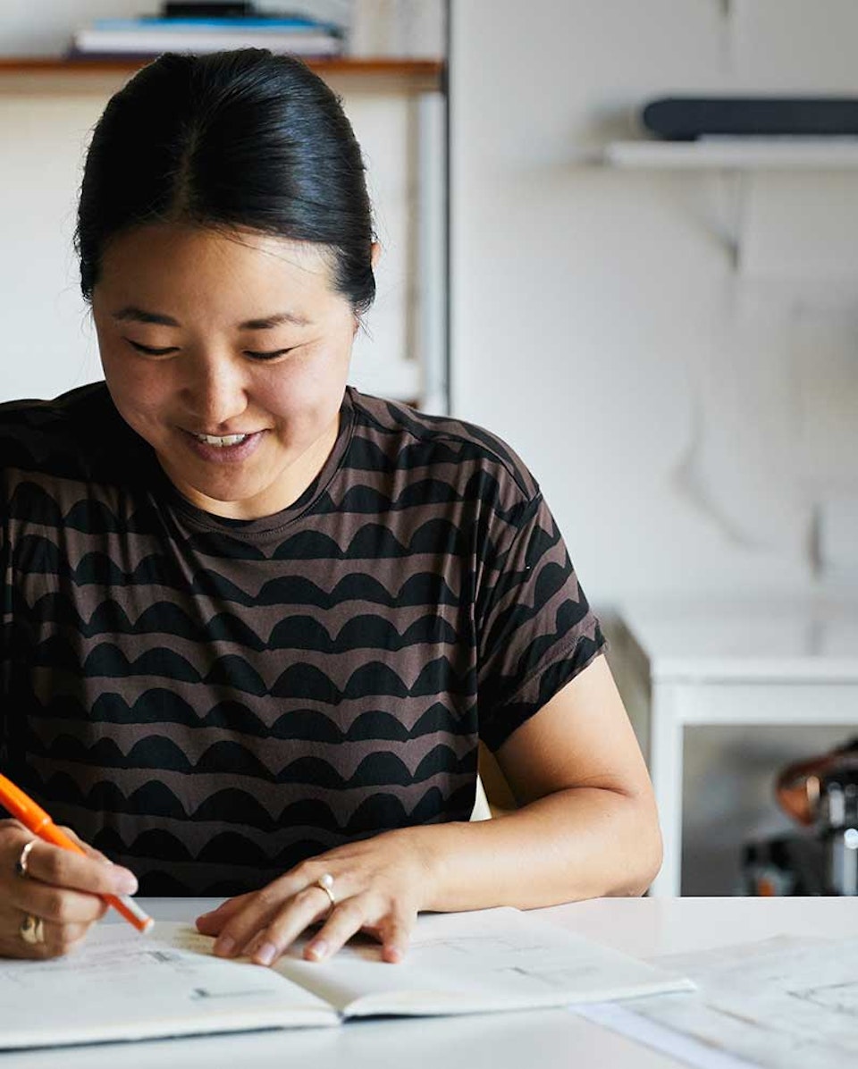 Grace Lim on paper drawings and measuring tapes at brunch